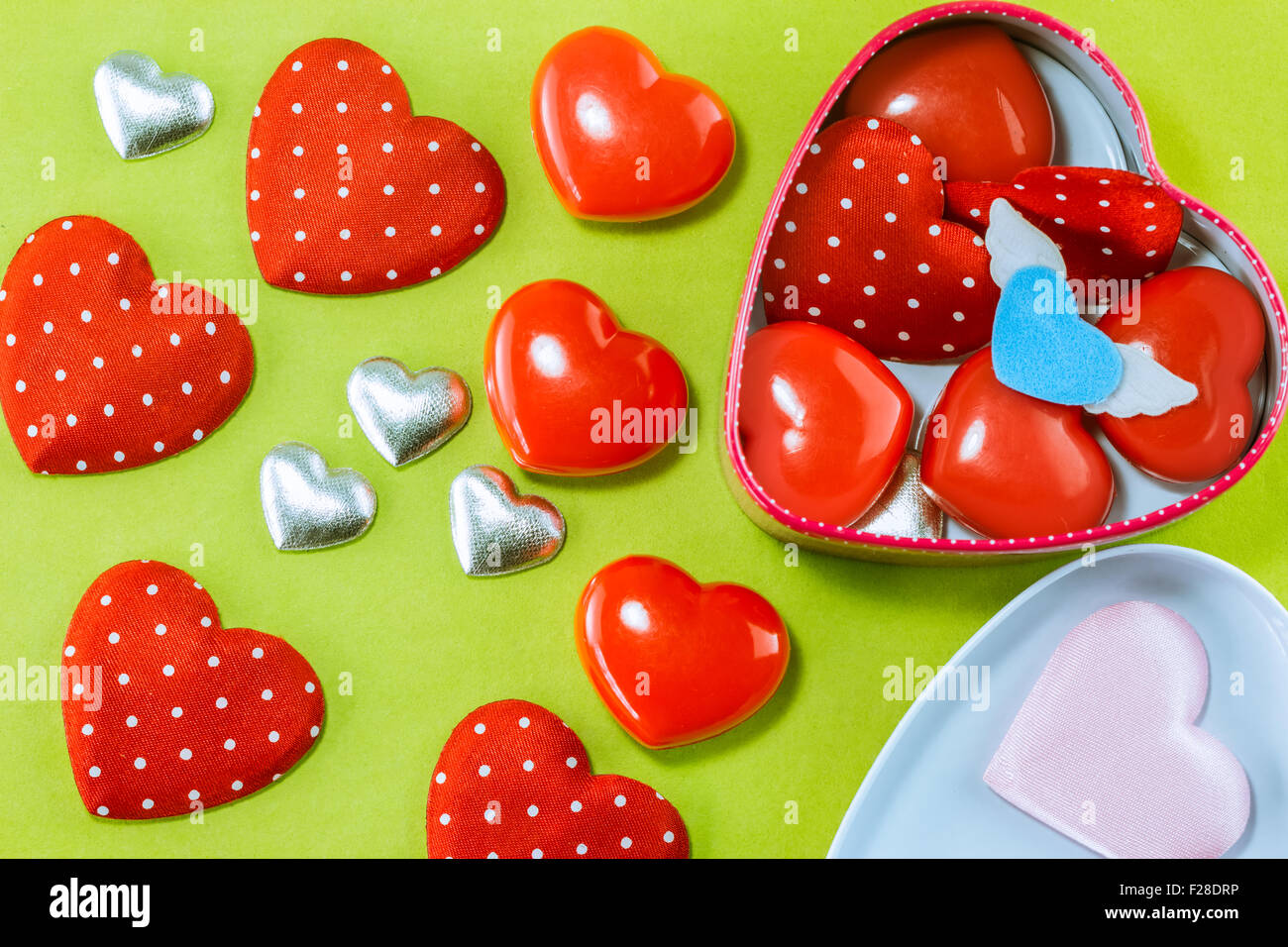many heart on green background Stock Photo - Alamy