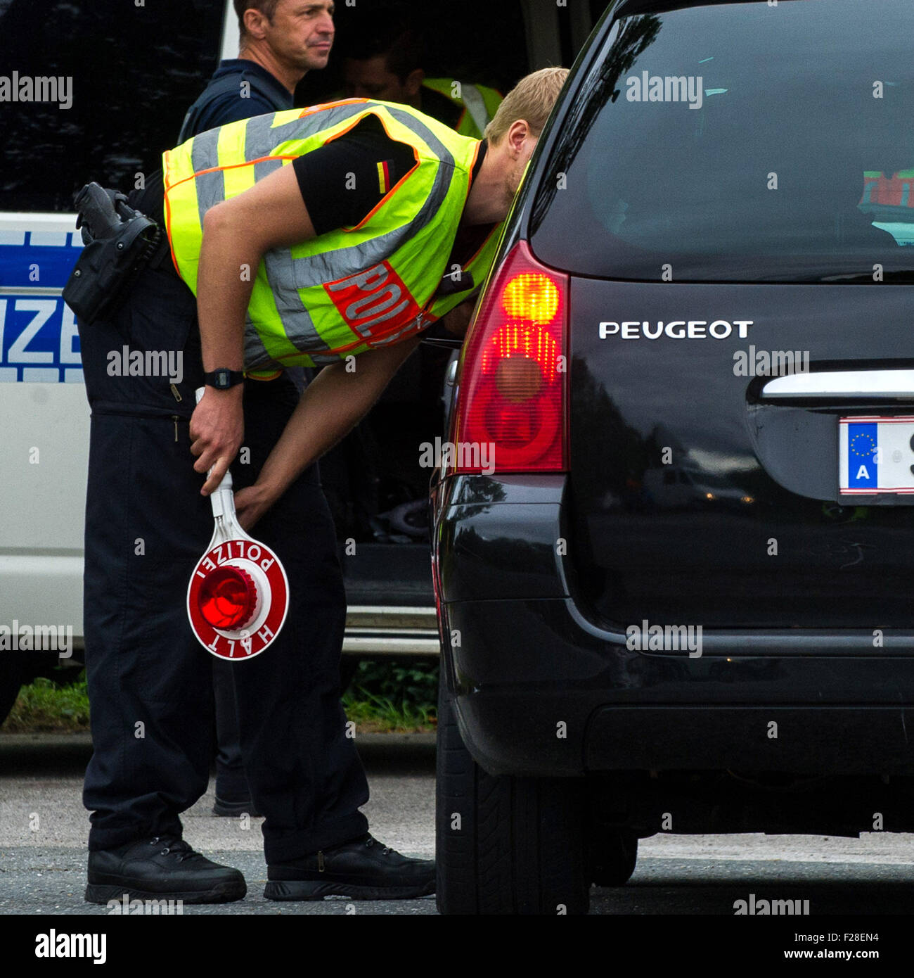 Salzburg, Austria. 14th Sep, 2015. German police officers check ...