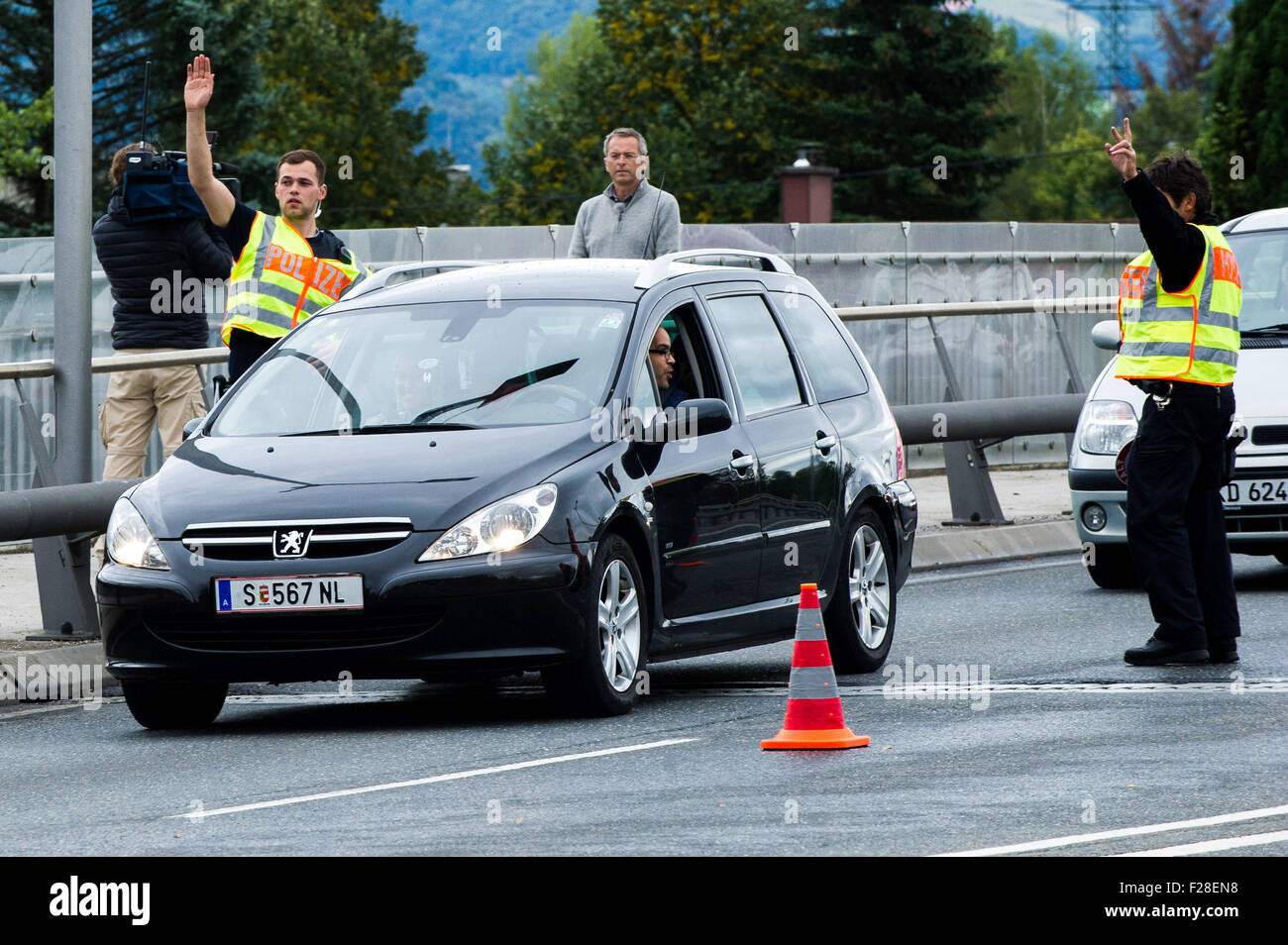 Salzburg, Austria. 14th Sep, 2015. German police officers check ...