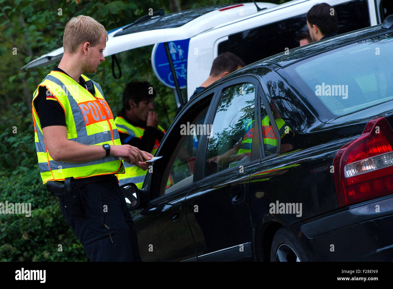 Salzburg, Austria. 14th Sep, 2015. German police officers check ...