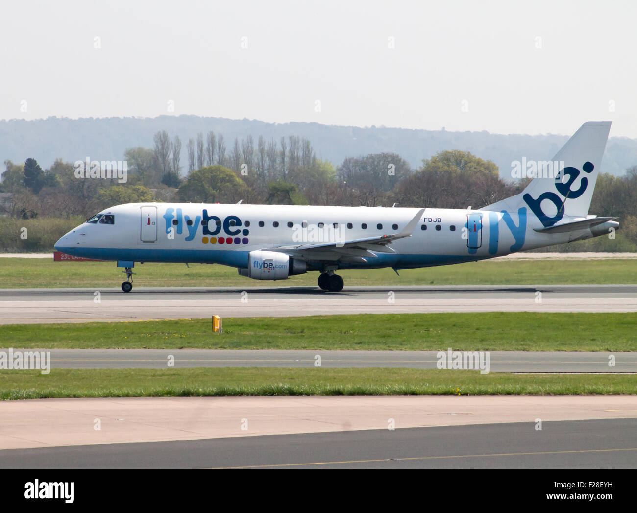 Flybe Embraer 175 passenger plane taking off from Manchester Airport ...