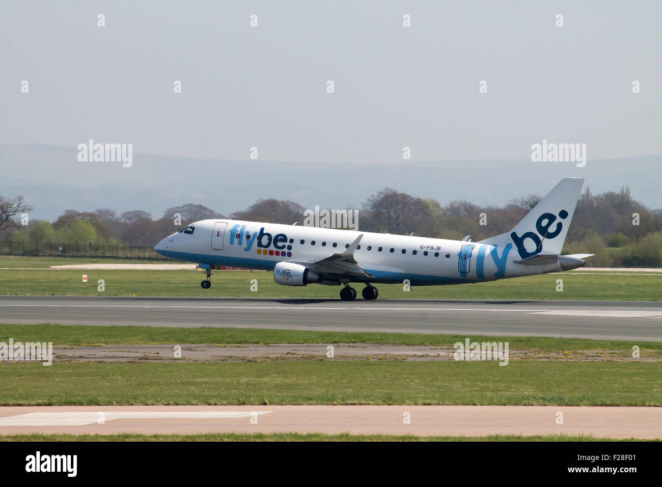 Flybe Embraer 175 passenger plane taking off from Manchester Airport ...