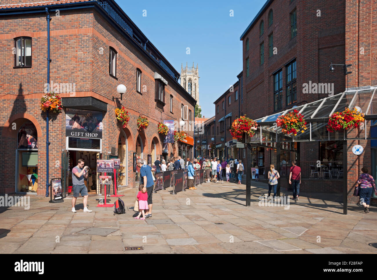People tourists visitors outside Jorvik Viking Centre in summer ...