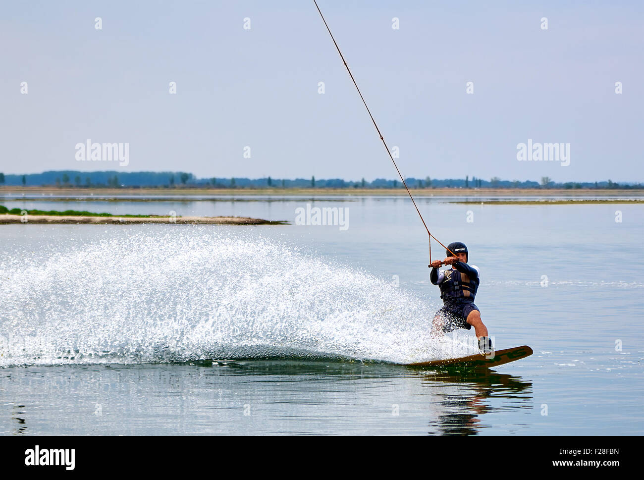 Wakeboarder shows extreme trick Stock Photo - Alamy
