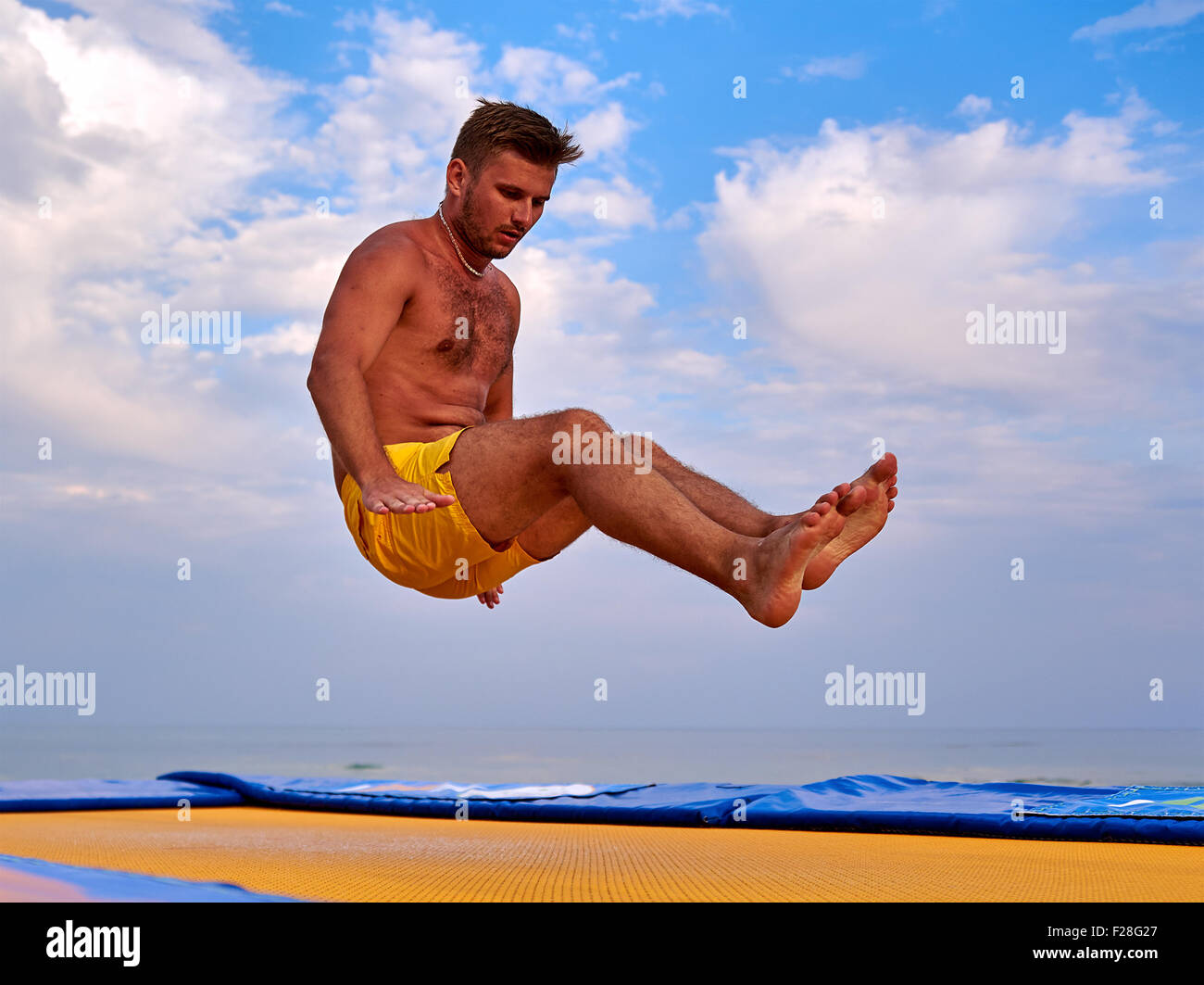 Flying man over beautiful sky Stock Photo - Alamy