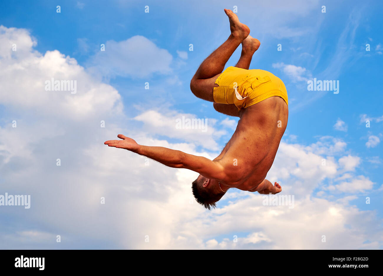 Flying man over beautiful sky Stock Photo - Alamy