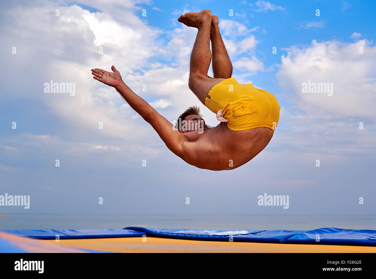 Flying man over beautiful sky Stock Photo - Alamy
