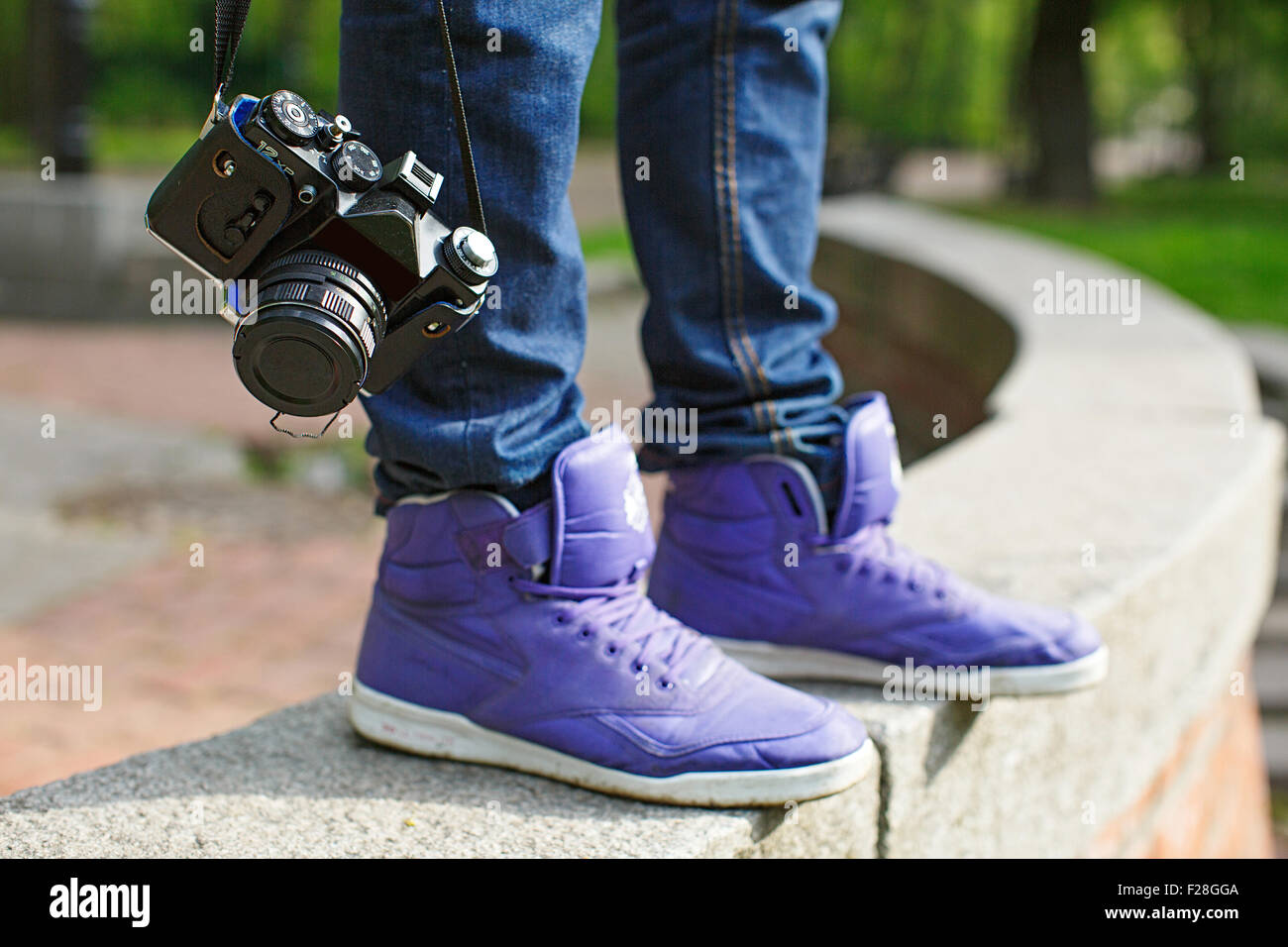 Unrecognizable traveler with vintage film camera standing on the ...