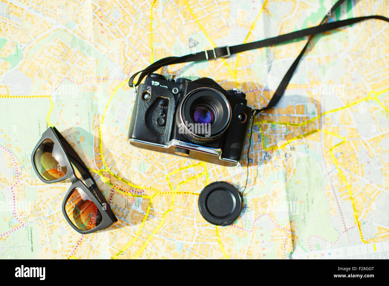 Retro camera and sunglasses on the tourist map, top view Stock Photo ...