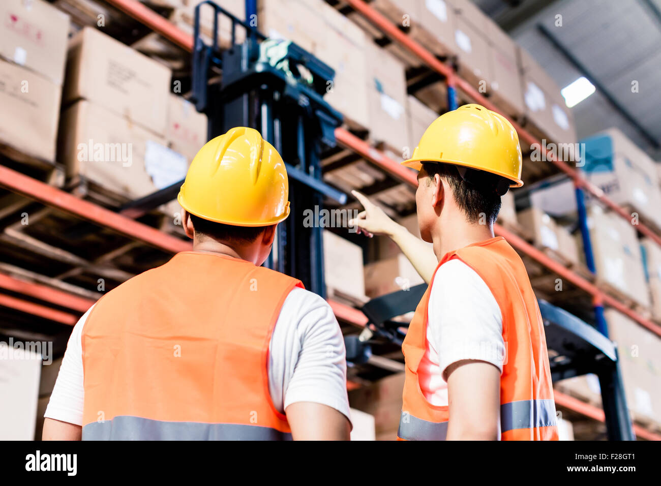 Worker team taking inventory in logistics warehouse Stock Photo - Alamy