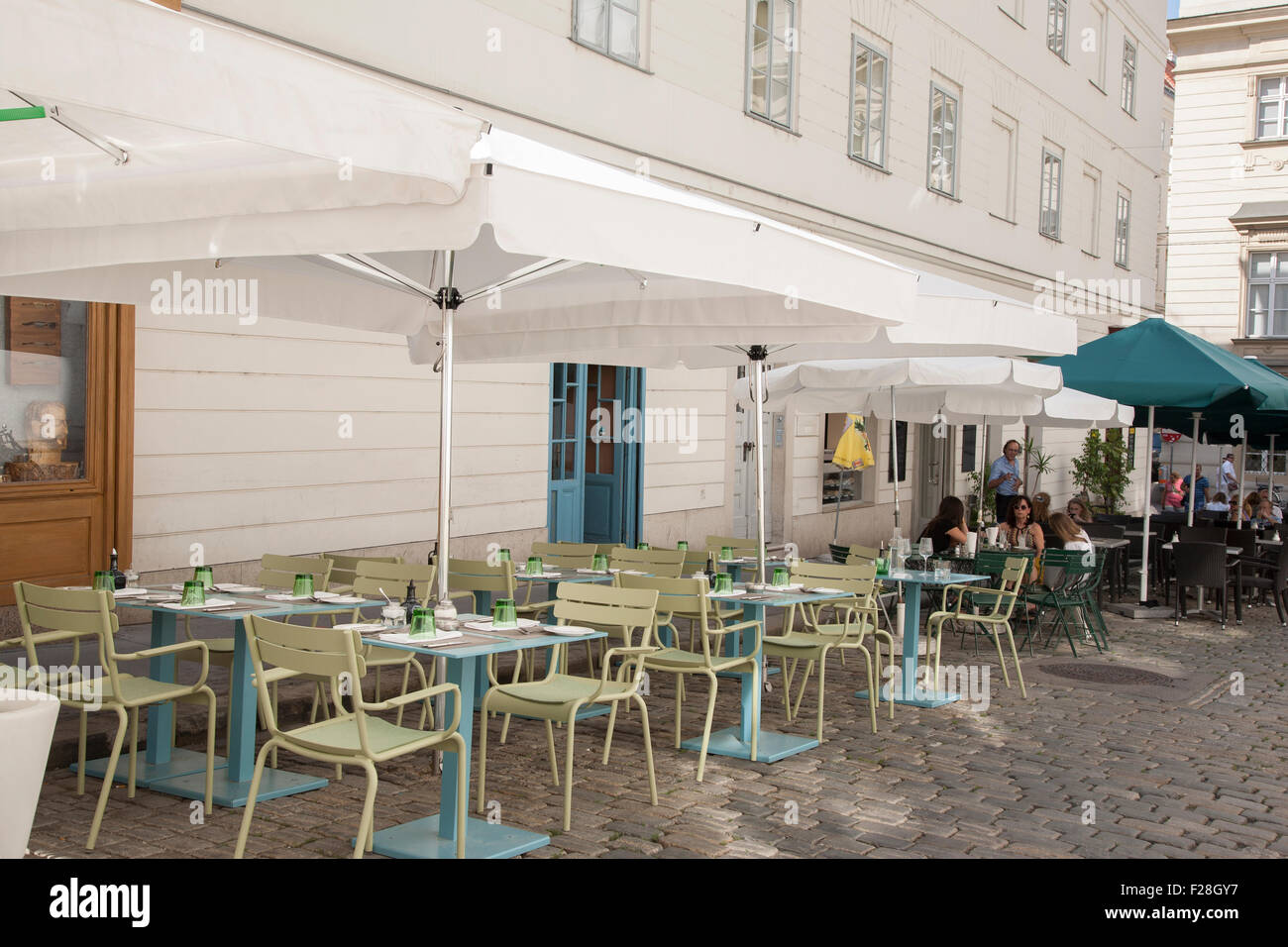 Cafe Tables and Chairs in Franziskanerplatz Street, Vienna, Austria ...