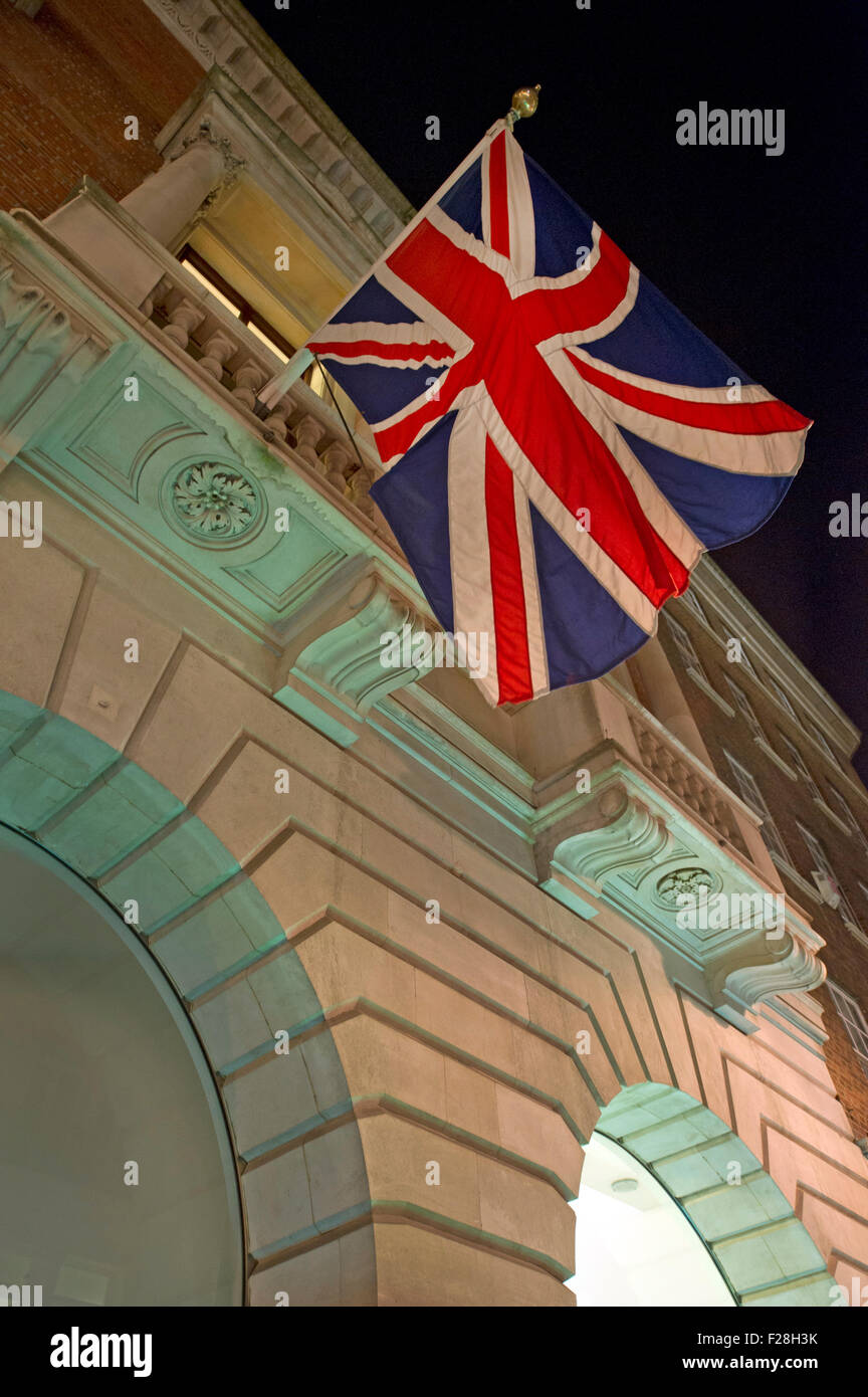British flag waving on a building in London illuminated at night Stock ...