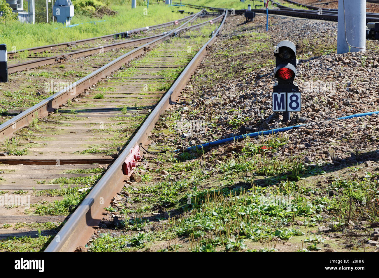 red light on railway track Stock Photo - Alamy