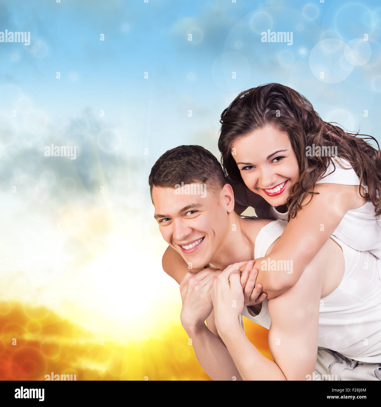 Young beautiful couple hugging Stock Photo - Alamy