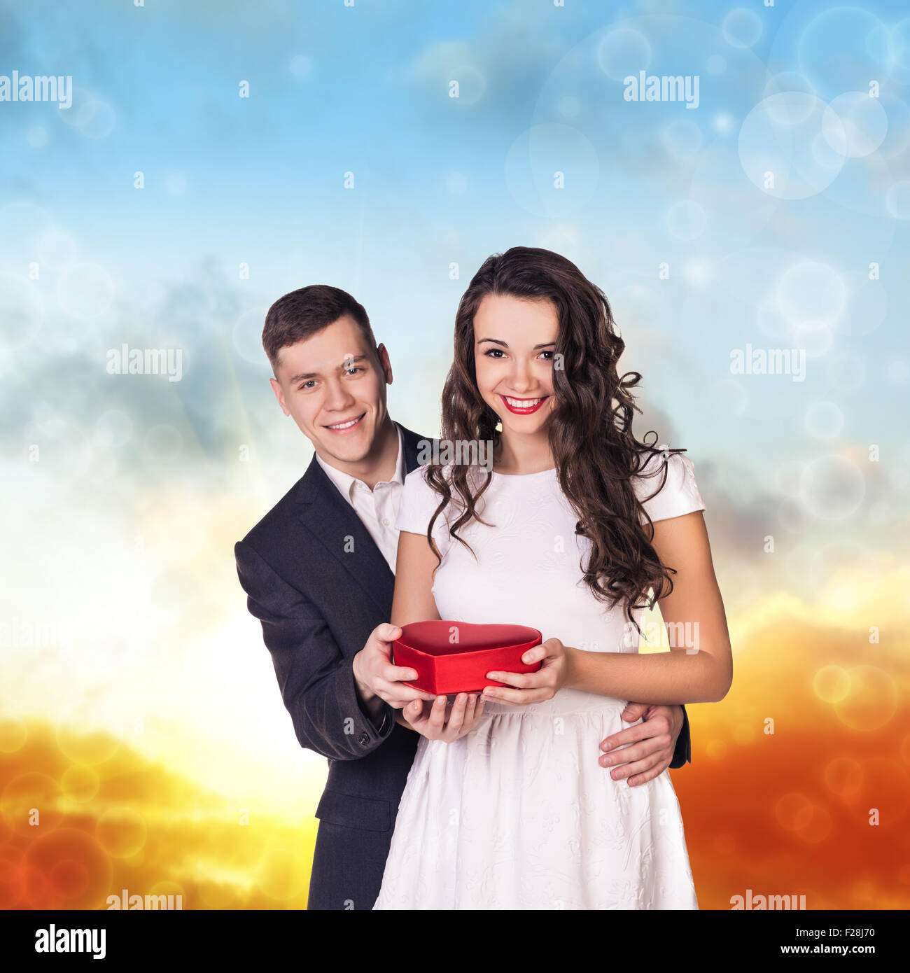 Young beautiful couple hugging Stock Photo - Alamy