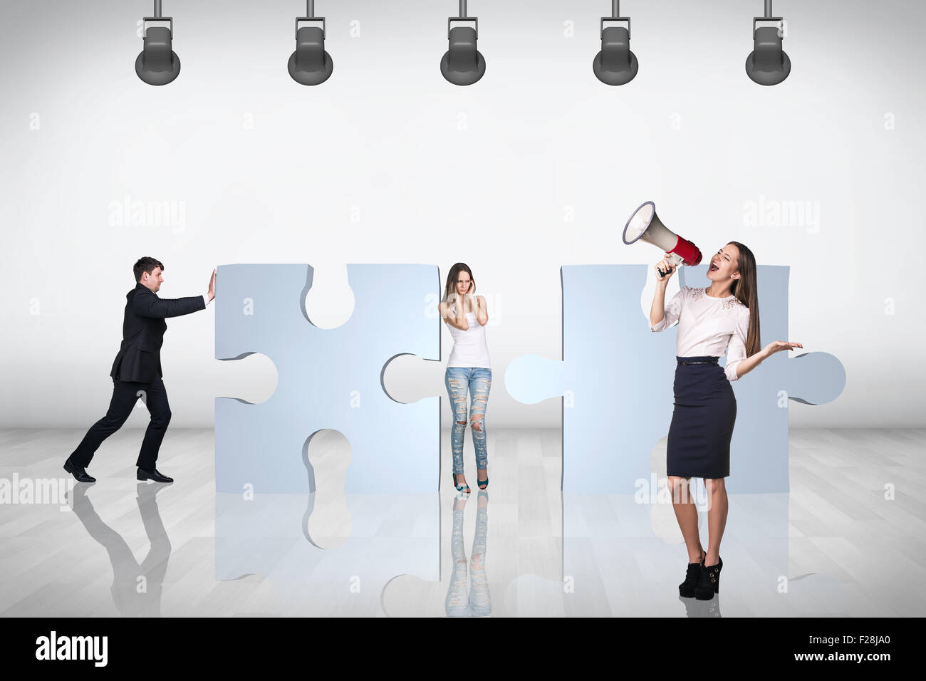 Team of business people try to join puzzle Stock Photo - Alamy