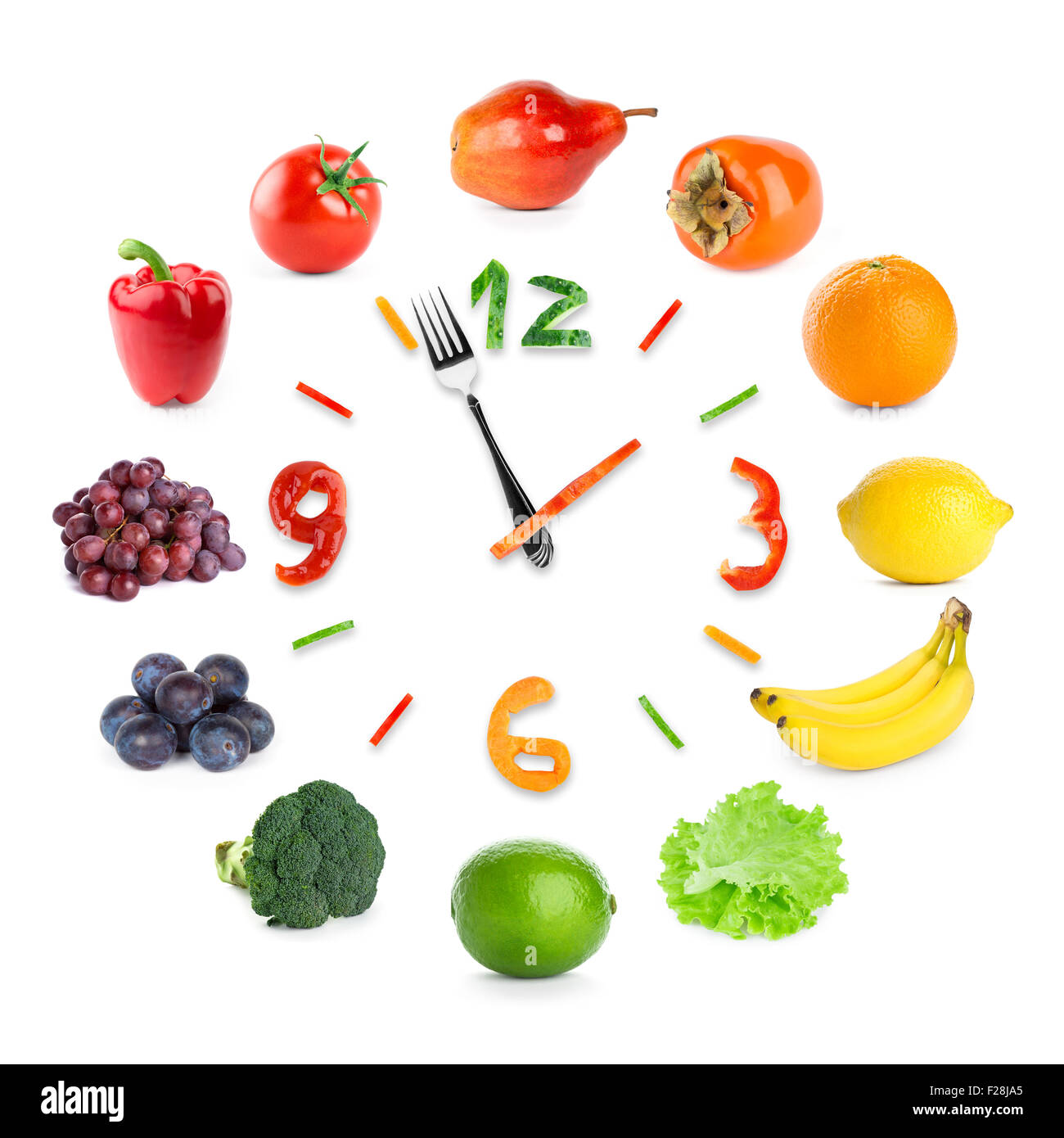 Food clock with fruits and vegetables on white background. Food concept ...