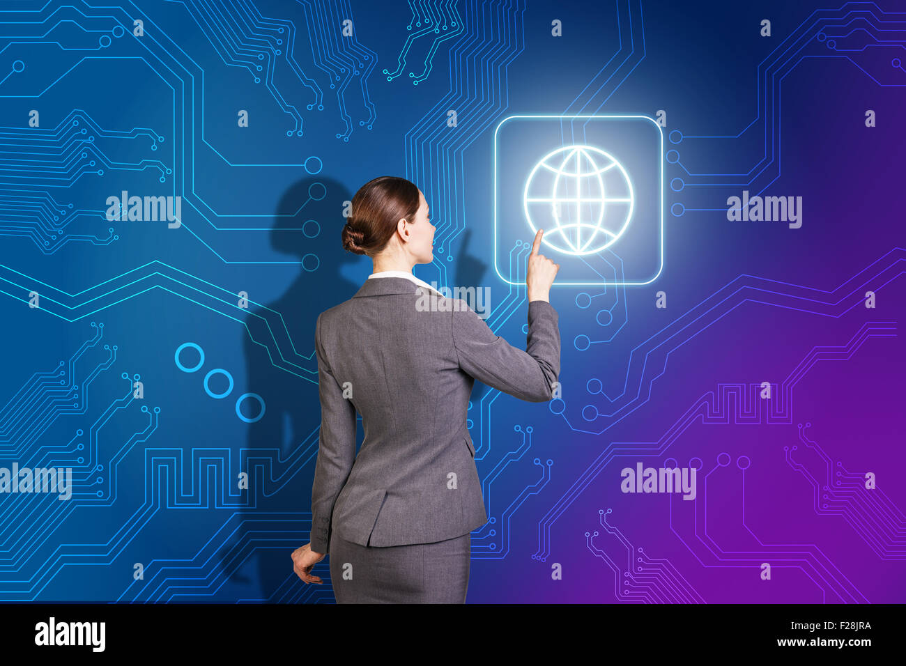 Smiling business woman point to the icon Stock Photo - Alamy
