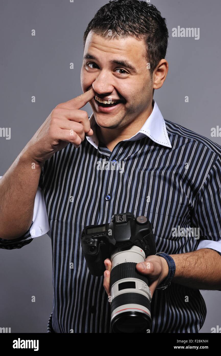 Funny man with a digital camera Stock Photo - Alamy