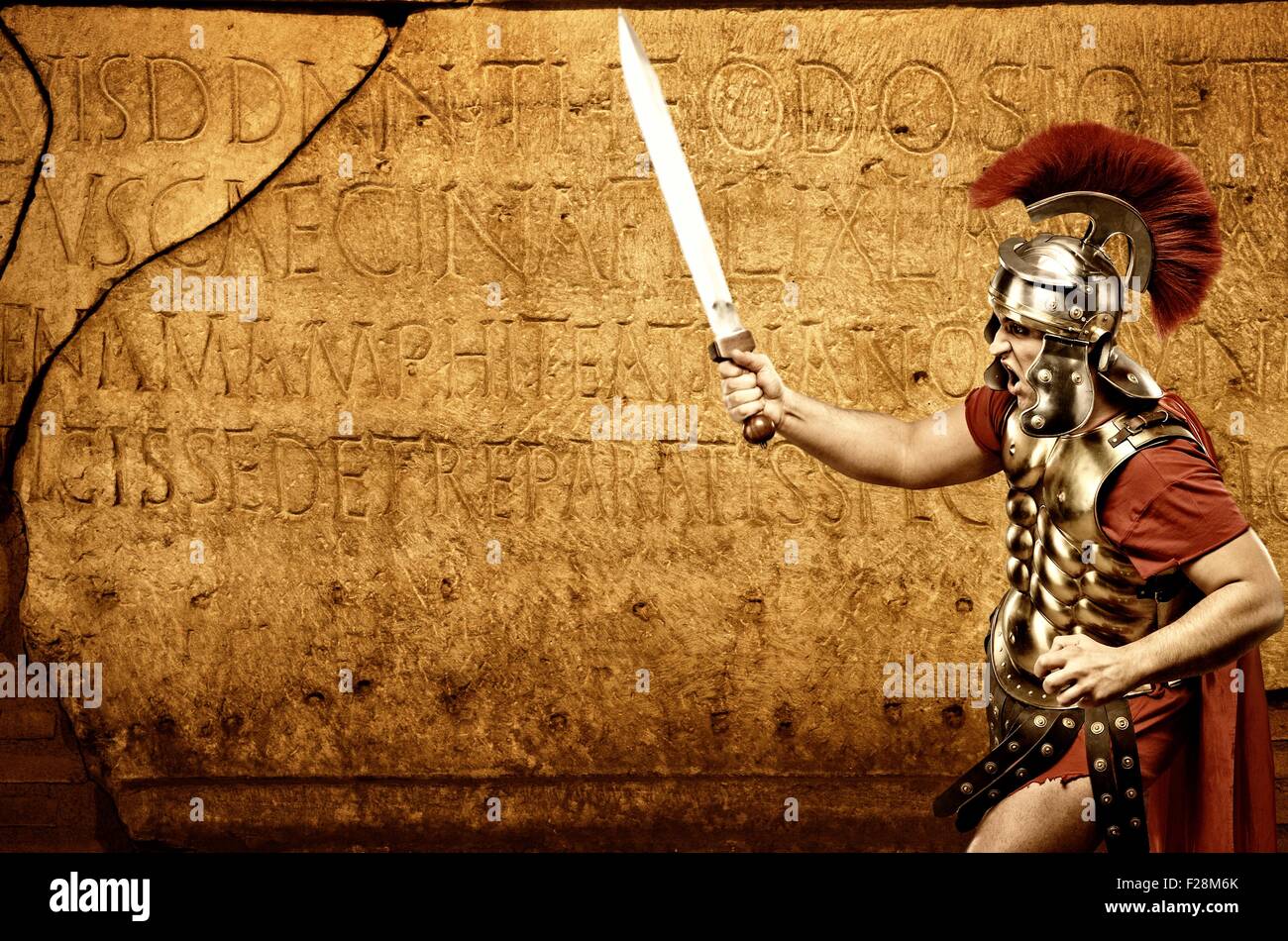 Roman legionary soldier in front of abstract wall Stock Photo - Alamy