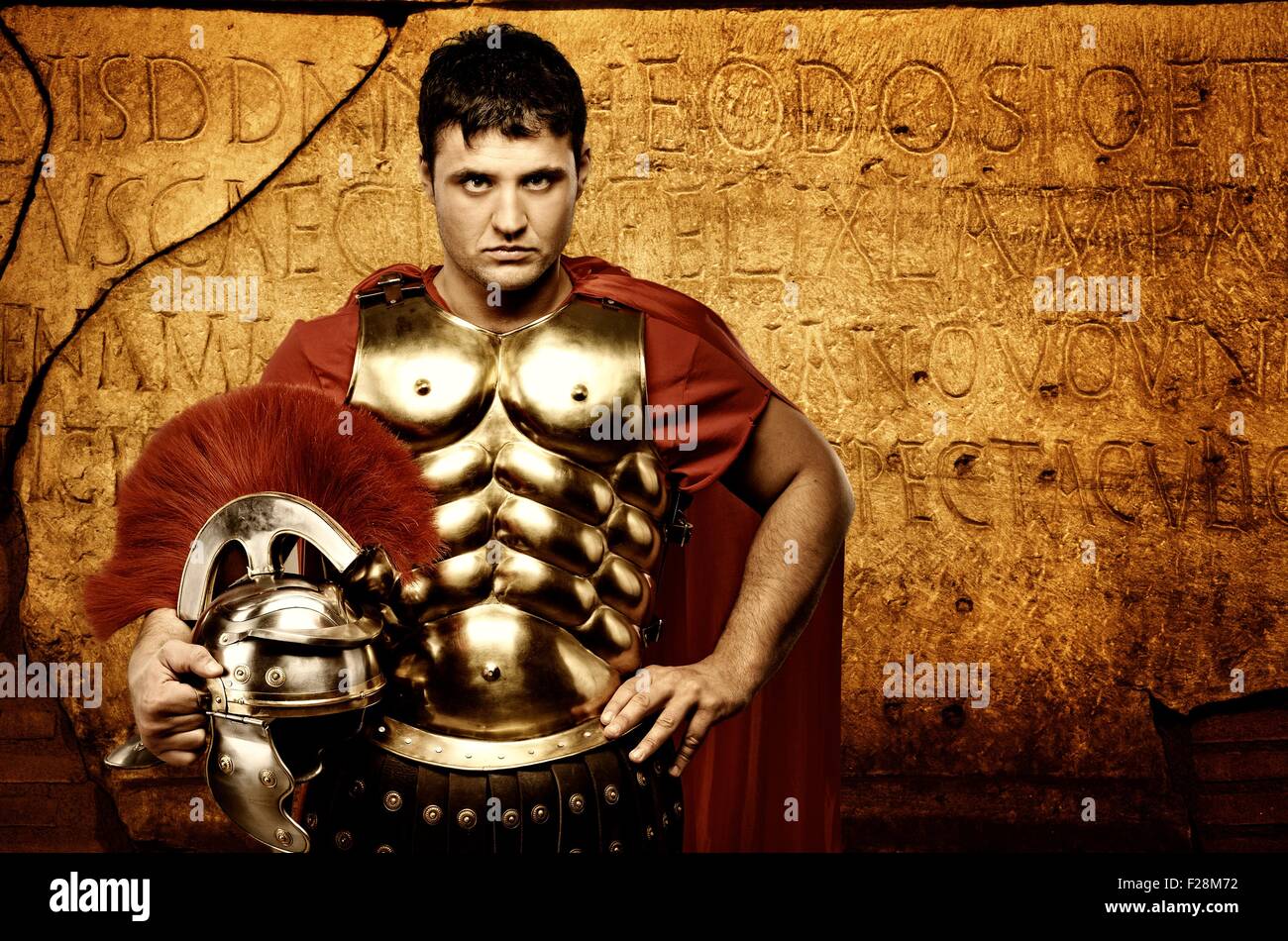 Legionary soldier in front of roman wall Stock Photo - Alamy