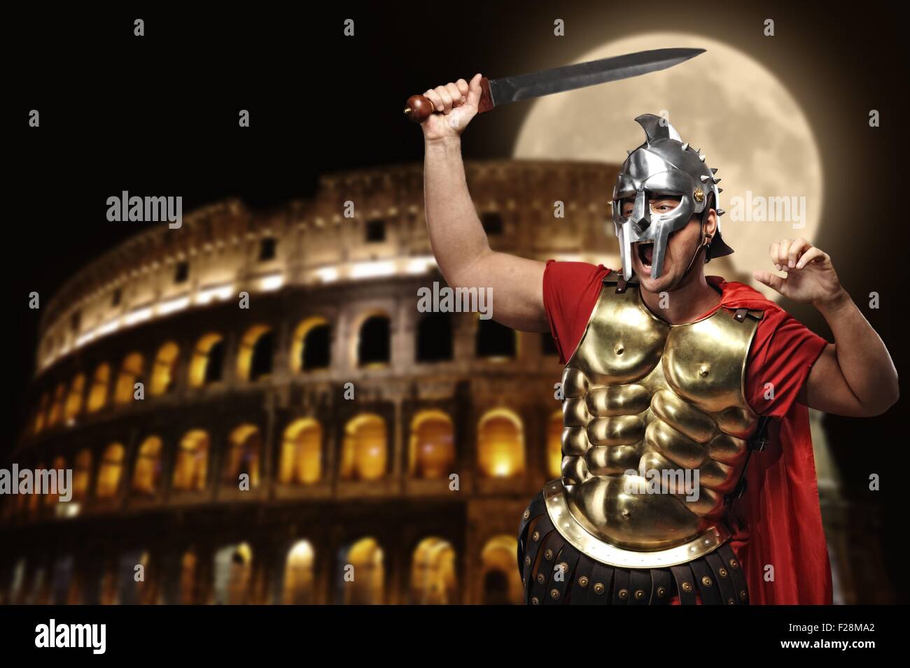 Roman legionary soldier in front of coliseum at night time Stock Photo ...