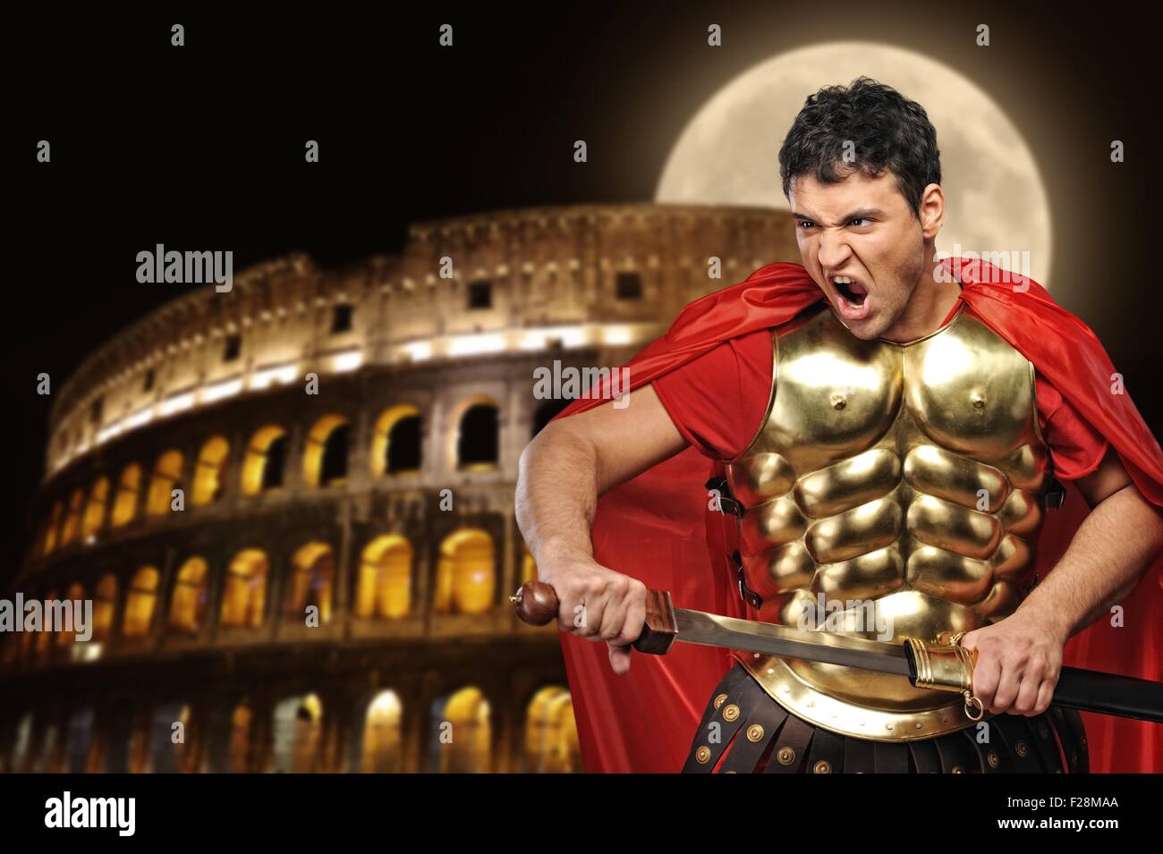 Roman legionary soldier in front of coliseum at night time Stock Photo ...