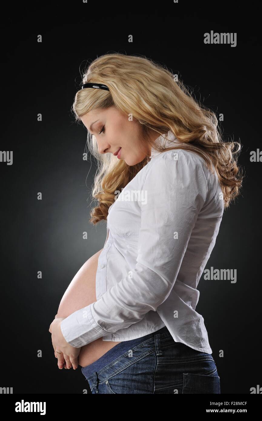 Beautiful pregnant woman expecting a baby Stock Photo - Alamy