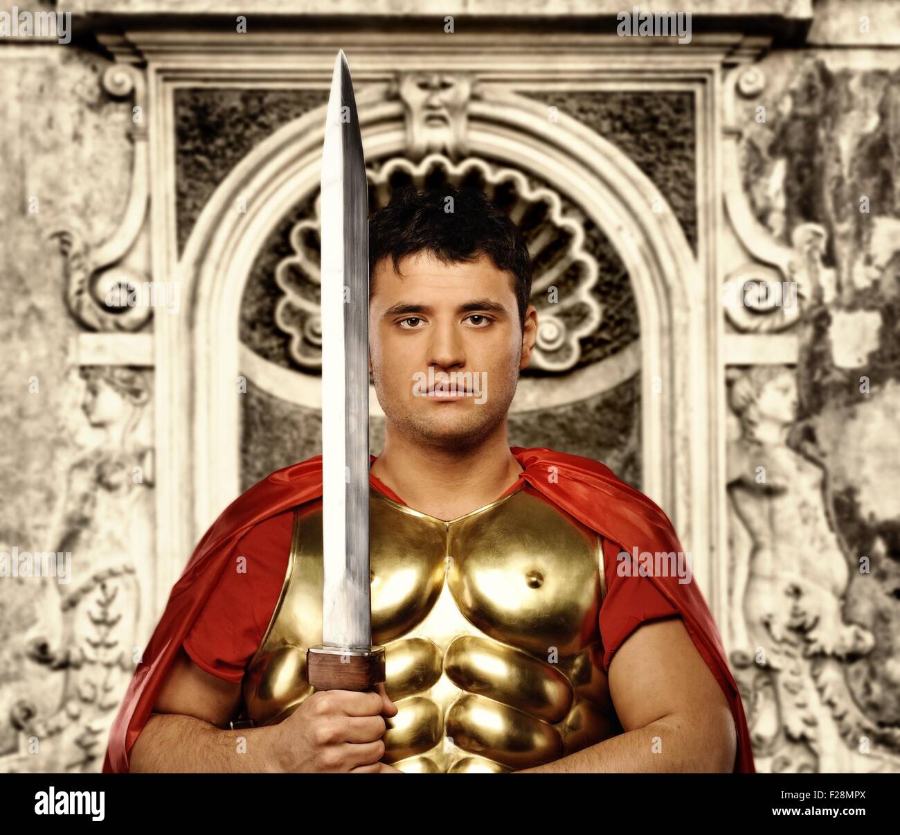 Roman legionary soldier in front of abstract wall Stock Photo - Alamy