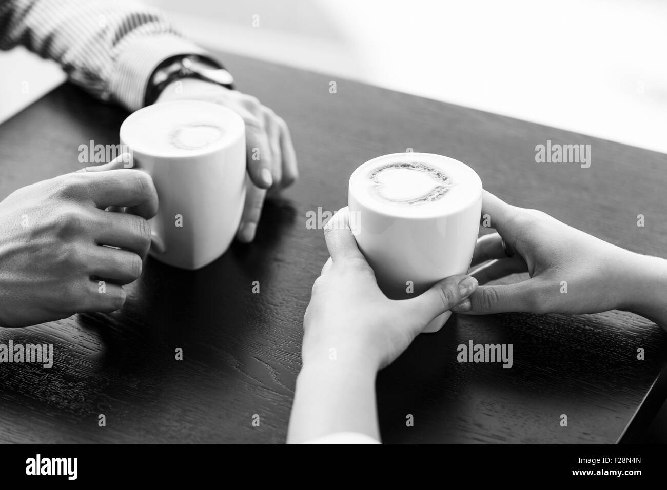Holding coffee cup Black and White Stock Photos & Images - Alamy