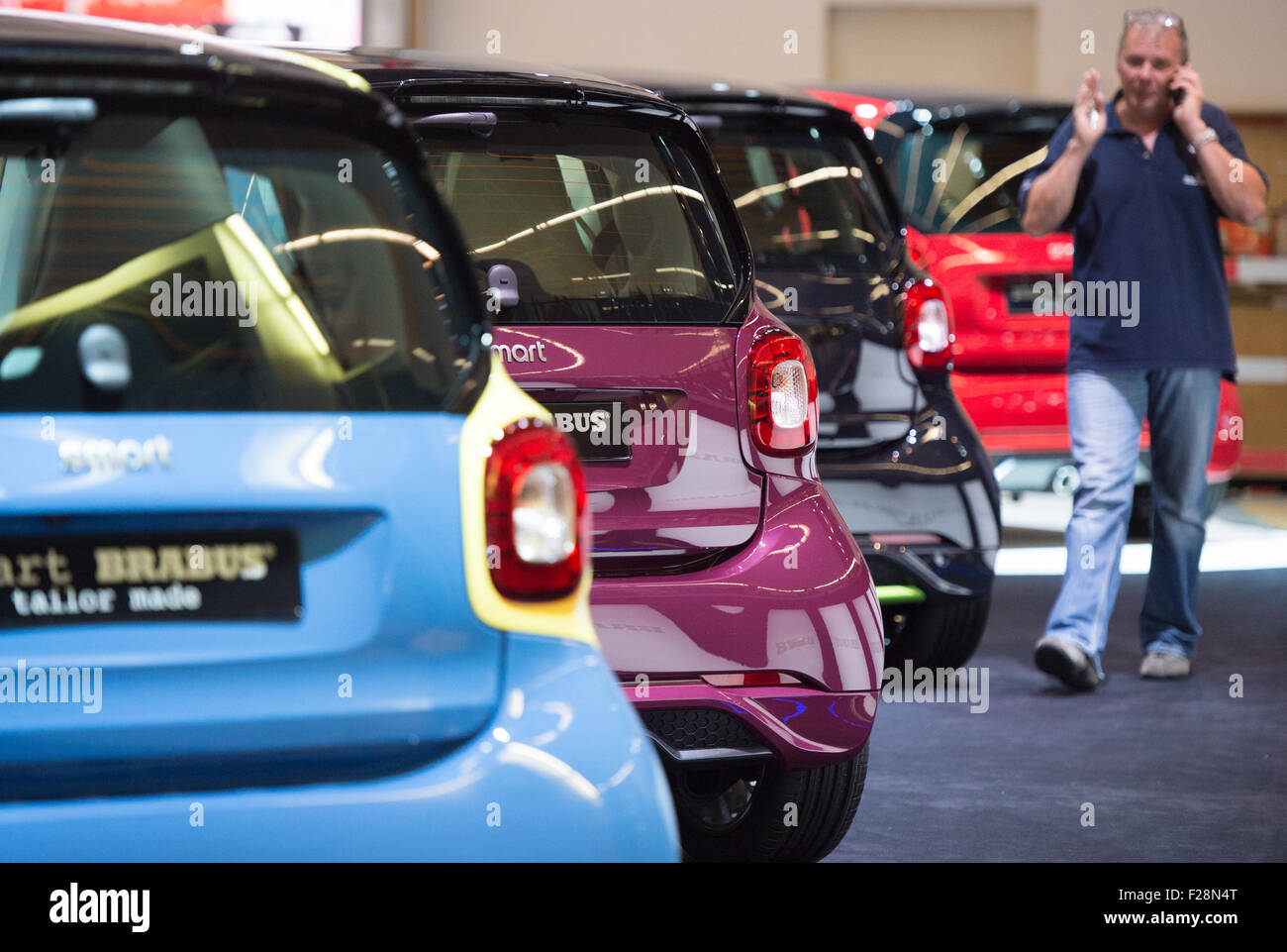 Smart cars are seen at the exhibition booth of Brabus at the ...