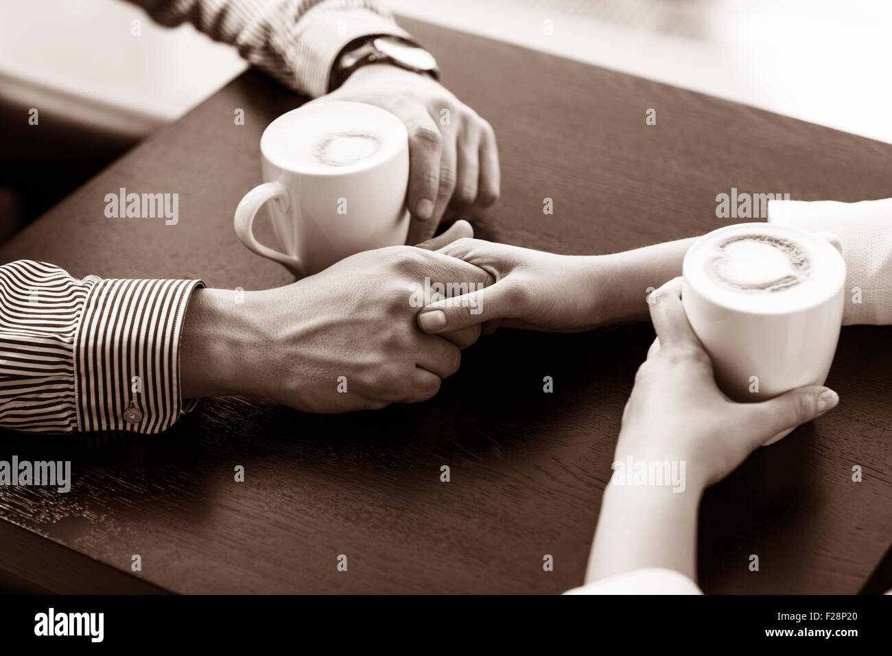 Two hands holding cup hi-res stock photography and images - Alamy