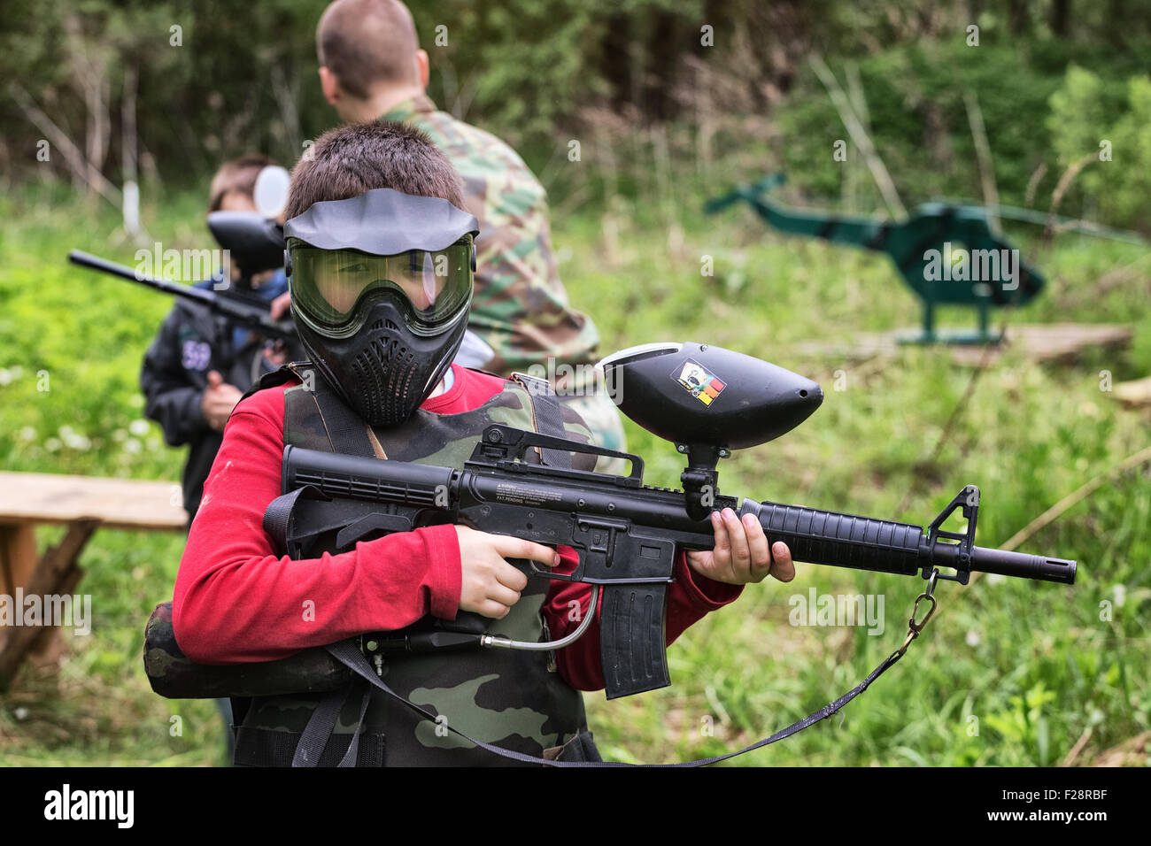 Paintball game on a special testing ground in spring forest. Vitebsk ...