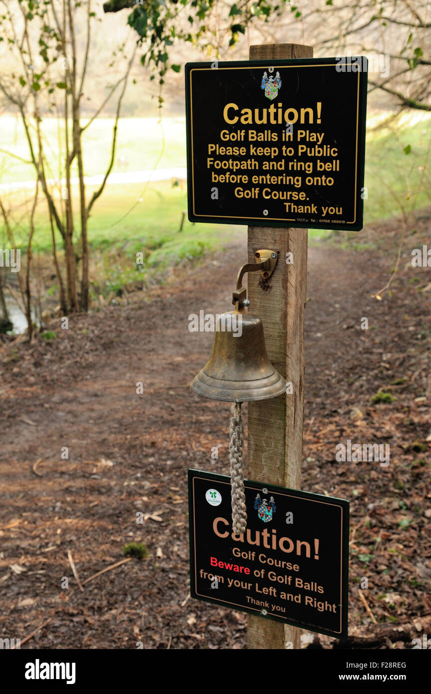 Warning notice on public footpath entering golf course Stock Photo - Alamy