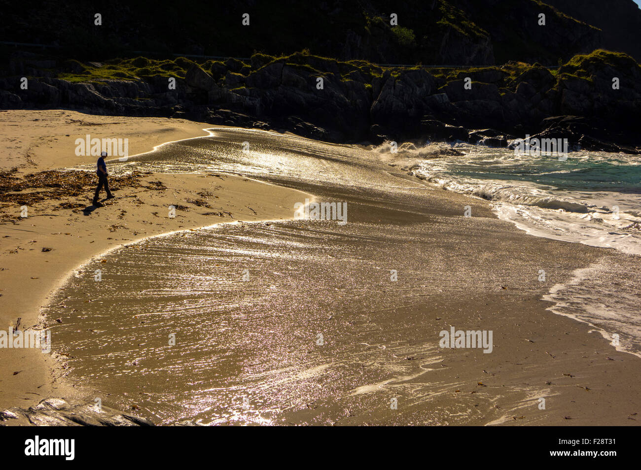 Small solitary figure on big wave washed beach, Andoya, Norway Stock ...