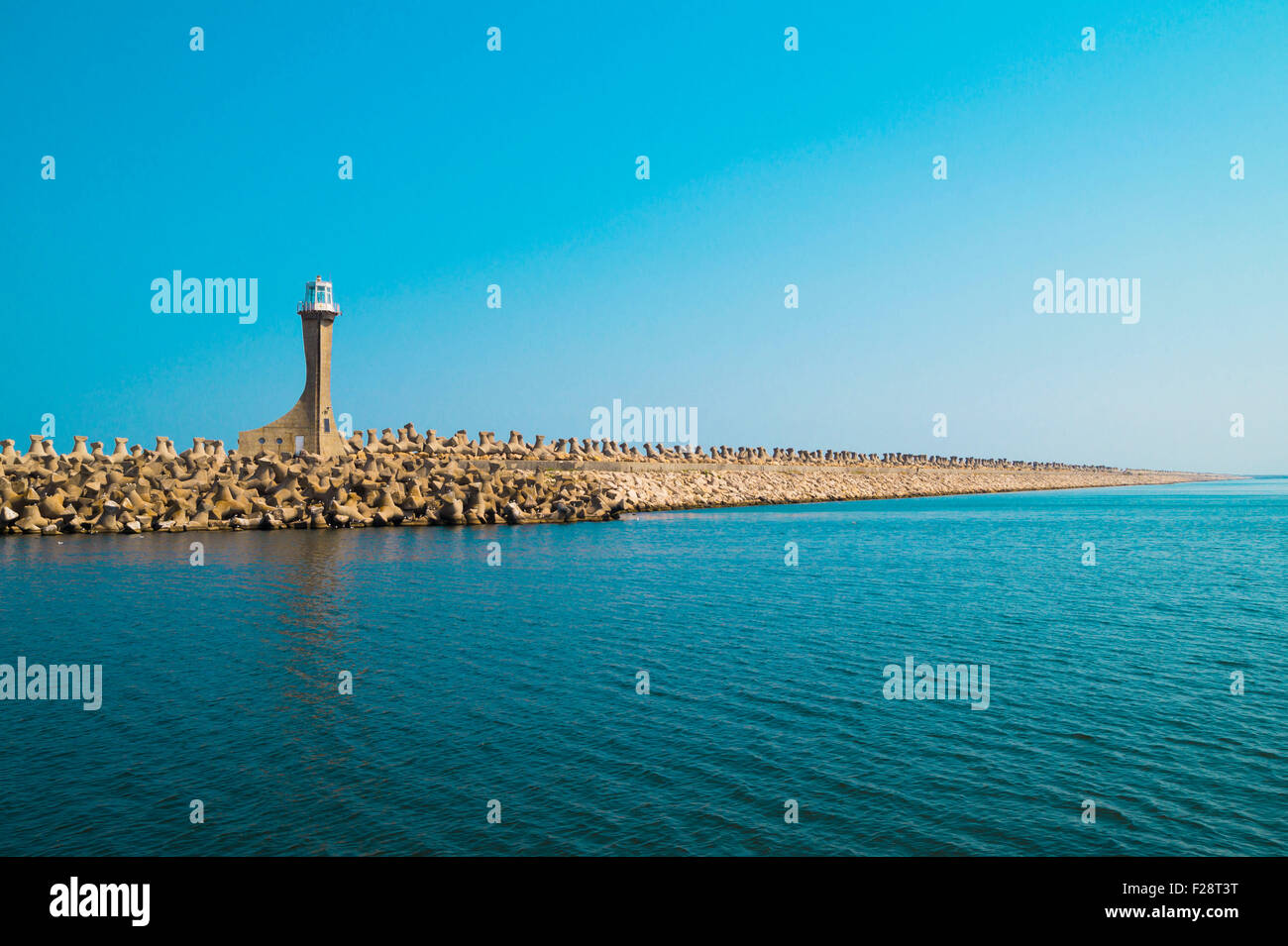 Lighthouse and breakwaters in Port Constanta, Romania Stock Photo - Alamy