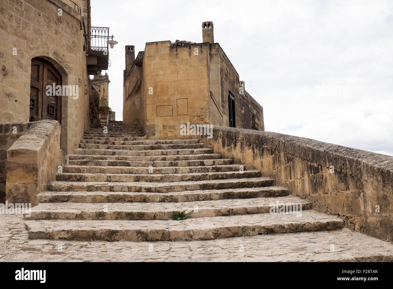 Stone steps and lower wall leading to homes in Sassi di Matera Stock ...