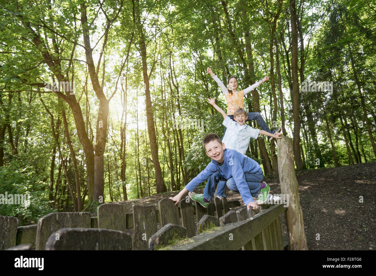 Three friends having fun in playground, Munich, Bavaria, Germany Stock ...
