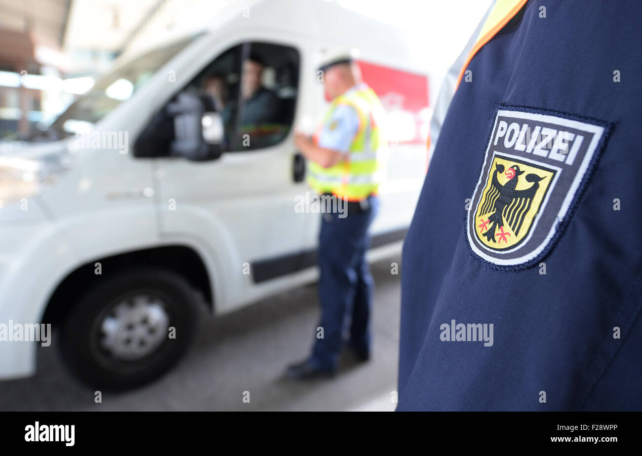 Members of the German Federal Police inspect a vehicle at a border ...