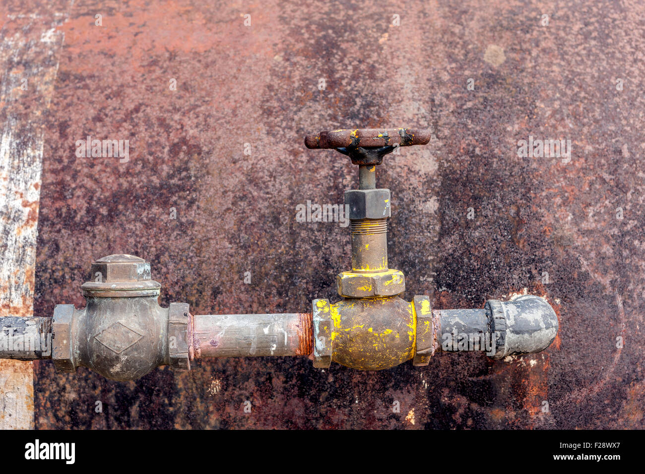 A close up of a rusted metal background and a pipe and valve Stock ...