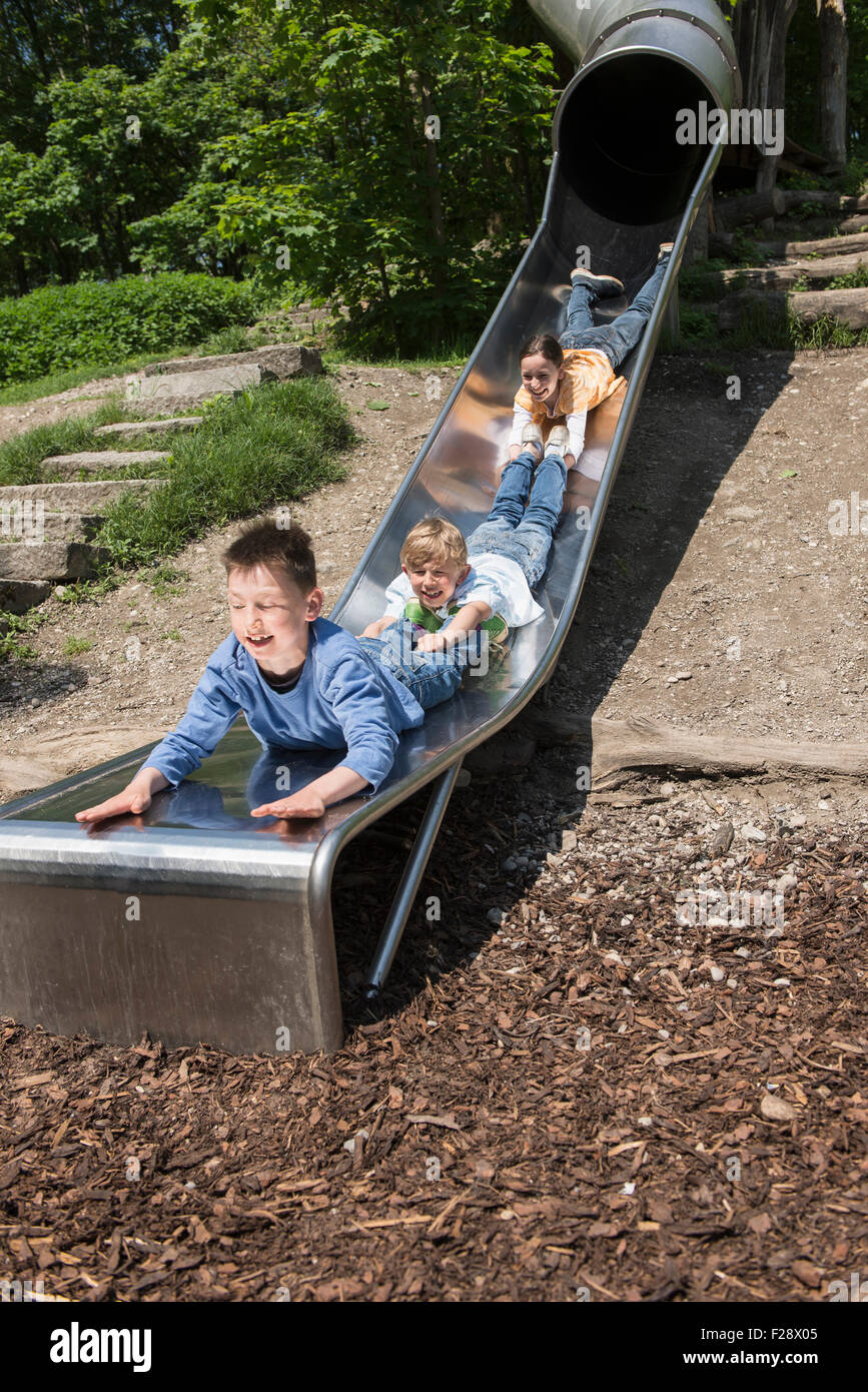 Child slide friends hi-res stock photography and images - Alamy