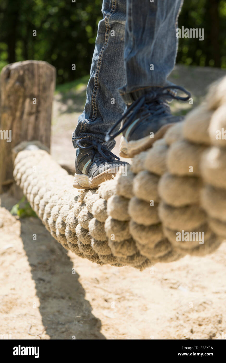 Girl balancing on rope in playground, Munich, Bavaria, Germany Stock ...