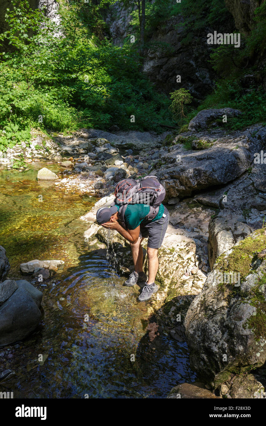 Hiker washing face in cold hi-res stock photography and images - Alamy