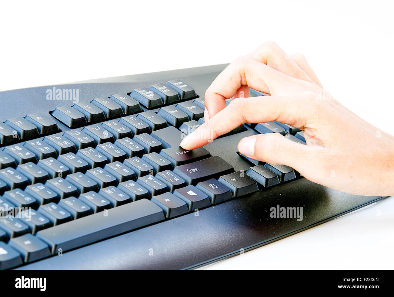 woman finger point to the enter on keyboard Stock Photo - Alamy