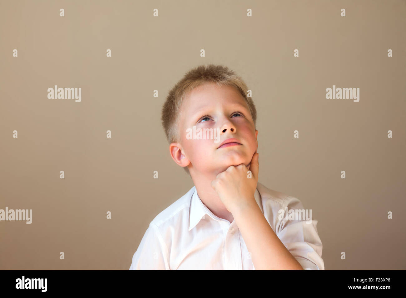 Boy thinking face expression hi-res stock photography and images - Alamy
