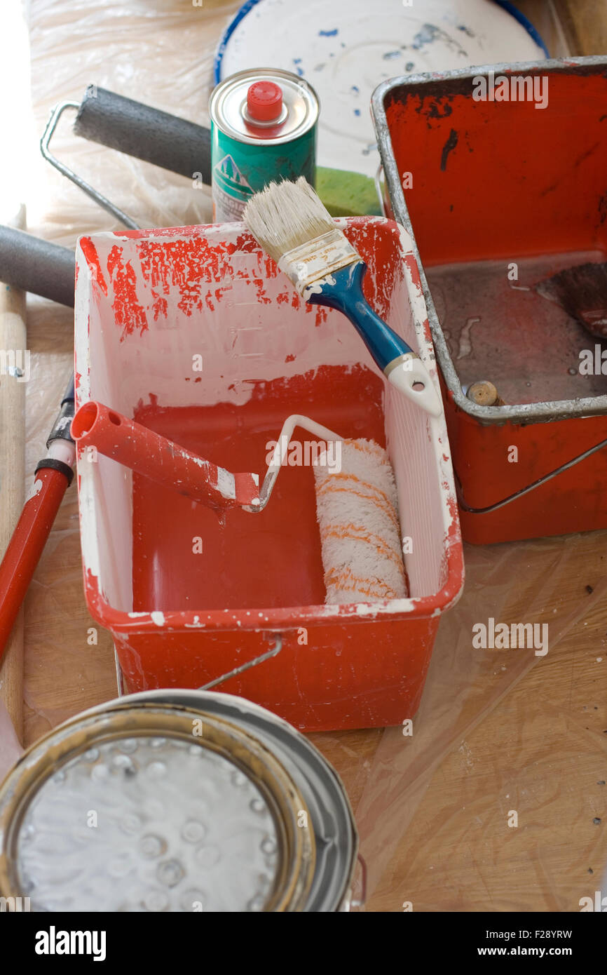 Dirty plastic containers of whitewasher Stock Photo - Alamy