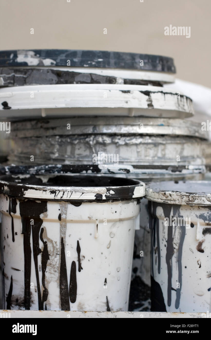 Photo of dirty plastic containers of paint Stock Photo - Alamy