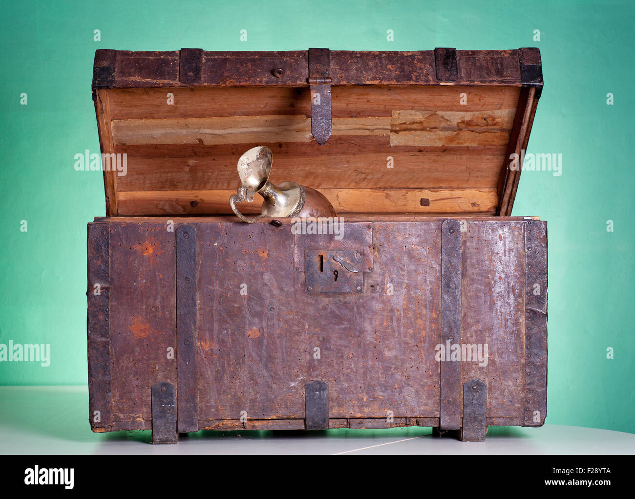 Glass pitcher inside an antique wooden trunk Stock Photo - Alamy