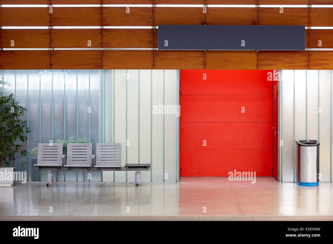 Railway station platform waiting area with seats Stock Photo - Alamy