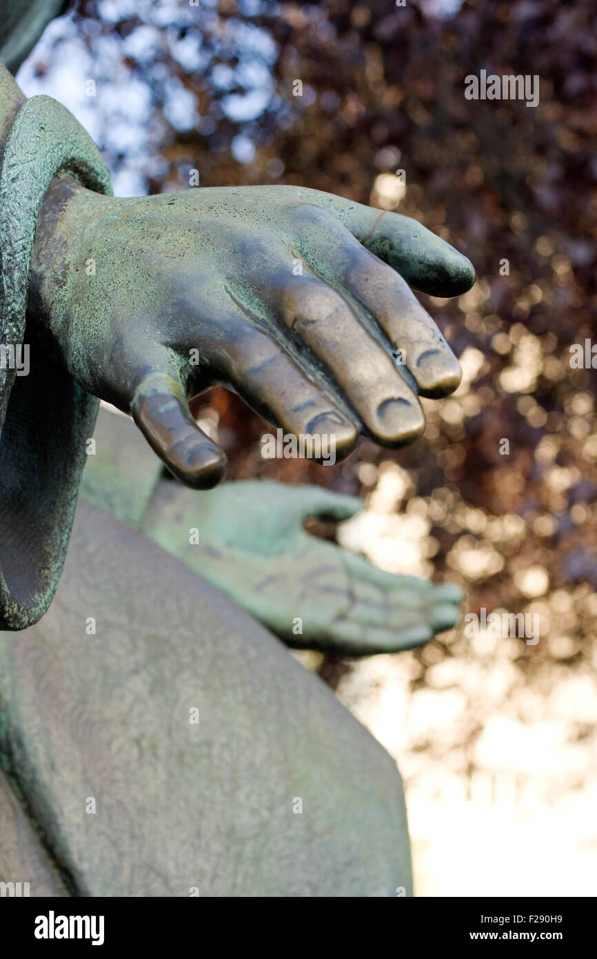 Hand of a bronze statue, Milan Stock Photo - Alamy